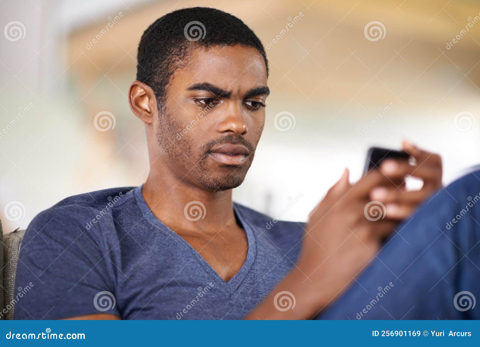 Making Plans for the Weekend. a Handsome Young Man Using His Cellphone ...