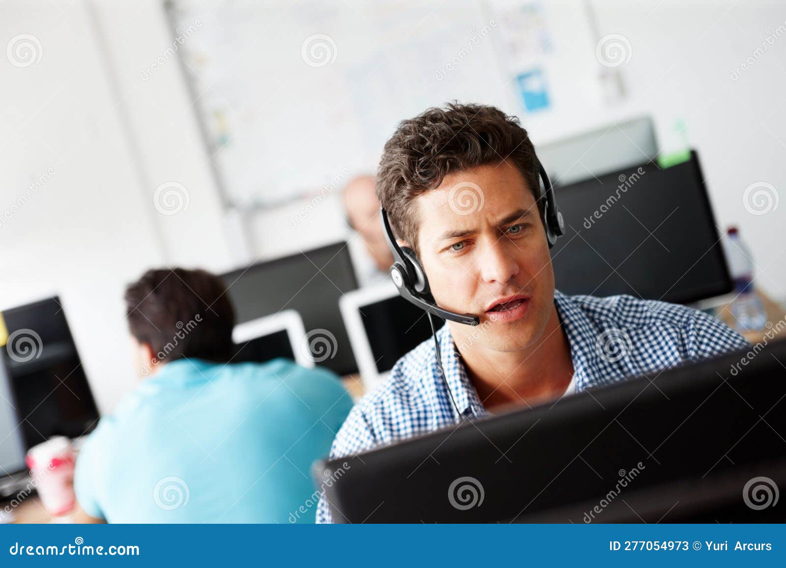 Making Sense of the Data. a Handsome Young Sales Assistant Talking on ...