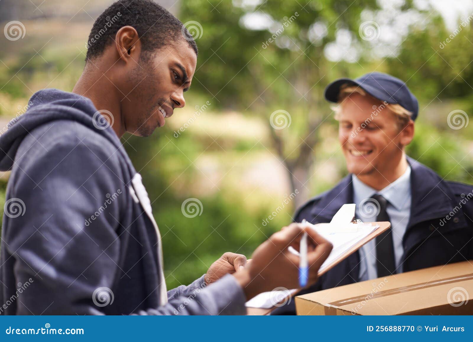 Making Sense of the Forms. a Handsome Young Man Signing a Form for a ...