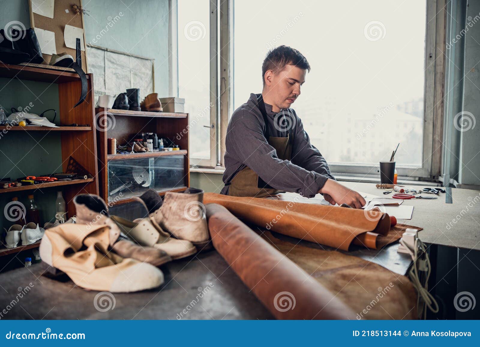 Before Making Shoes Out of Leather, a Young Guy Lays Them Out on the ...