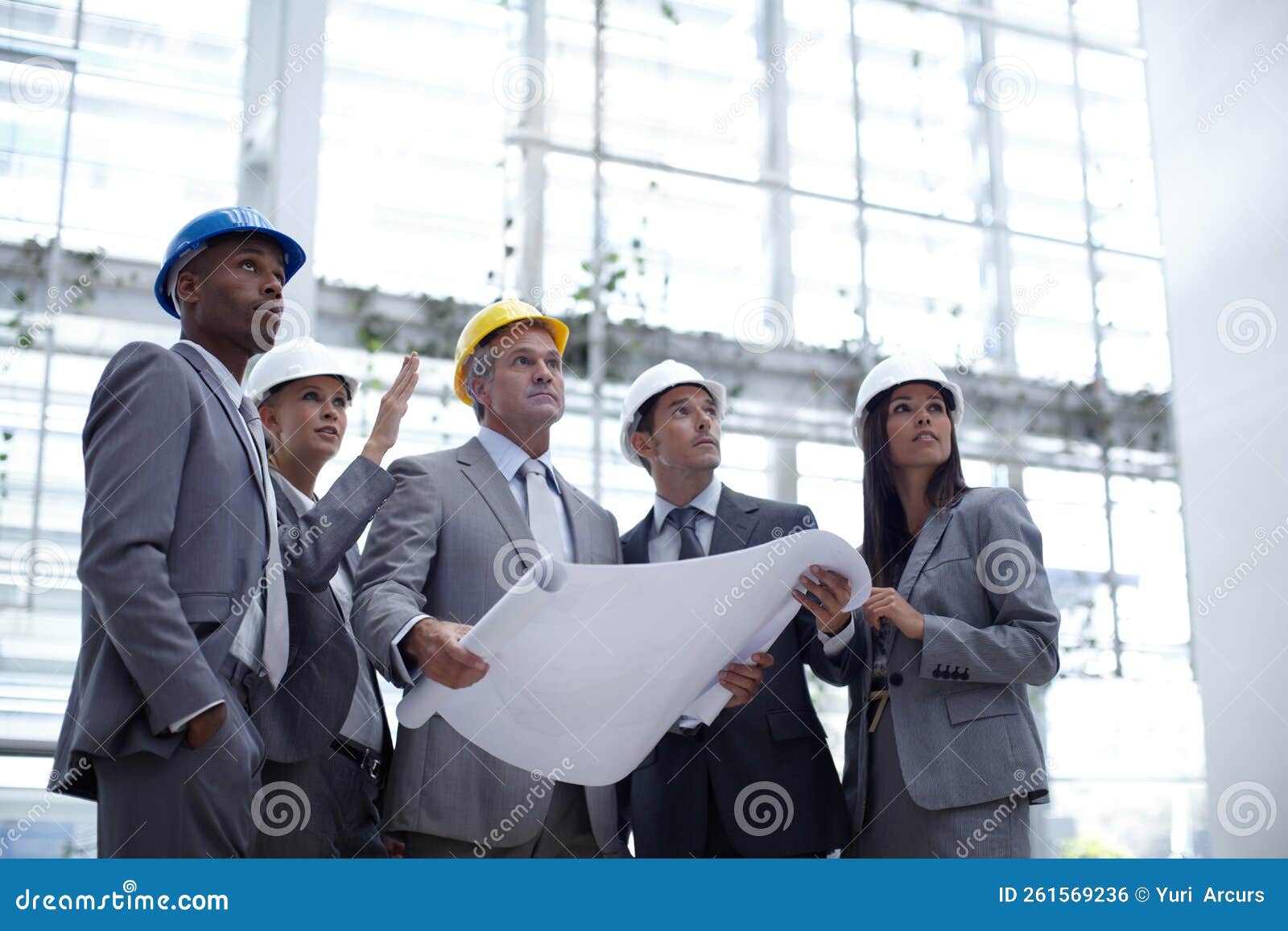 Making an on-sight Inspection...a Low Angle Shot of a Diverse Group of ...