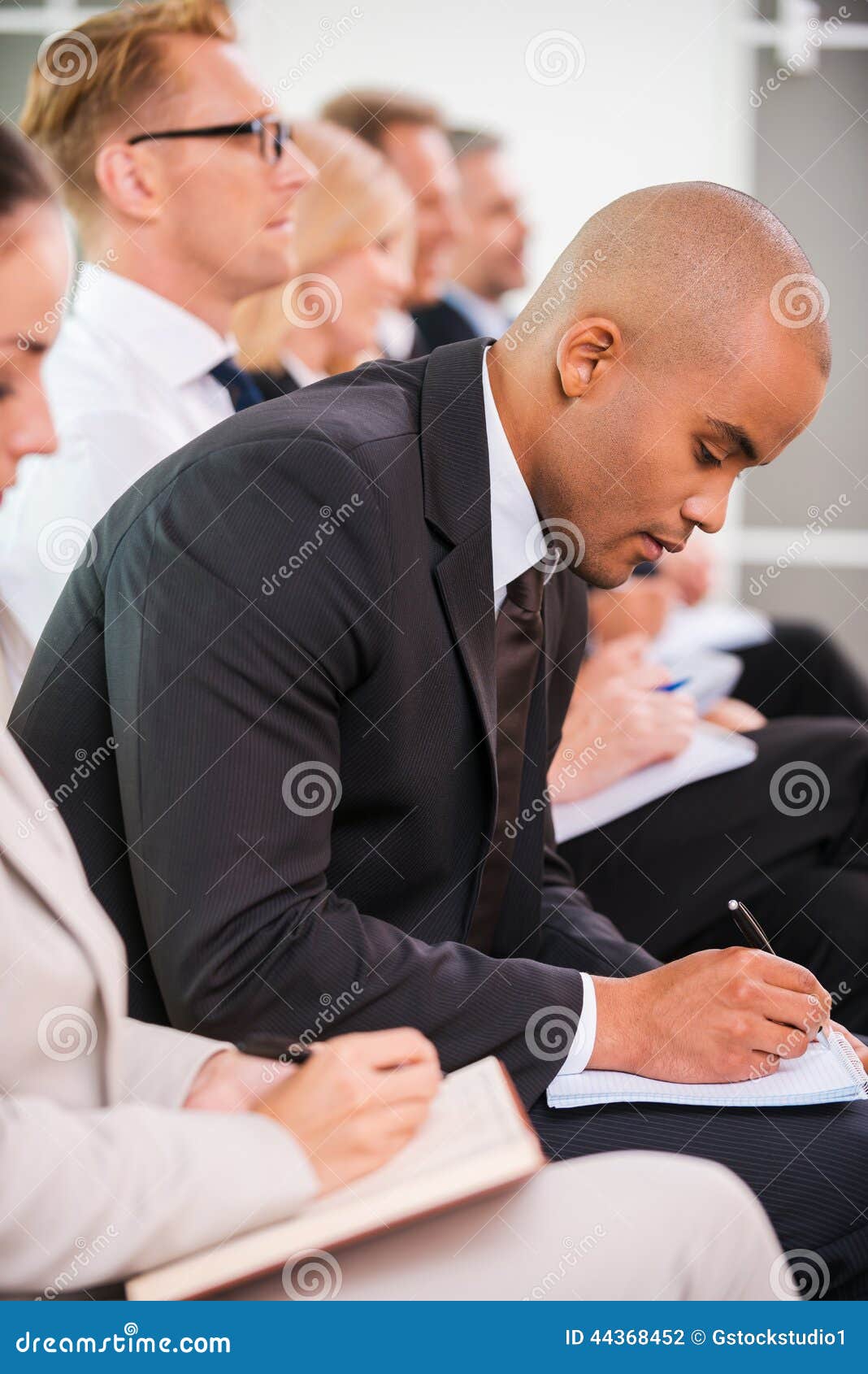 Making some urgent notes. stock photo. Image of group - 44368452