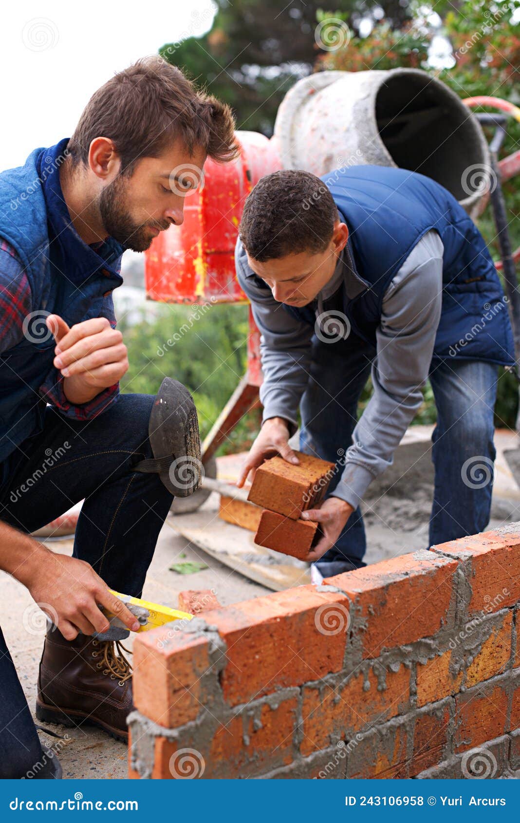 Making Strong Foundations Together. Shot of Bricklayers at Work. Stock ...