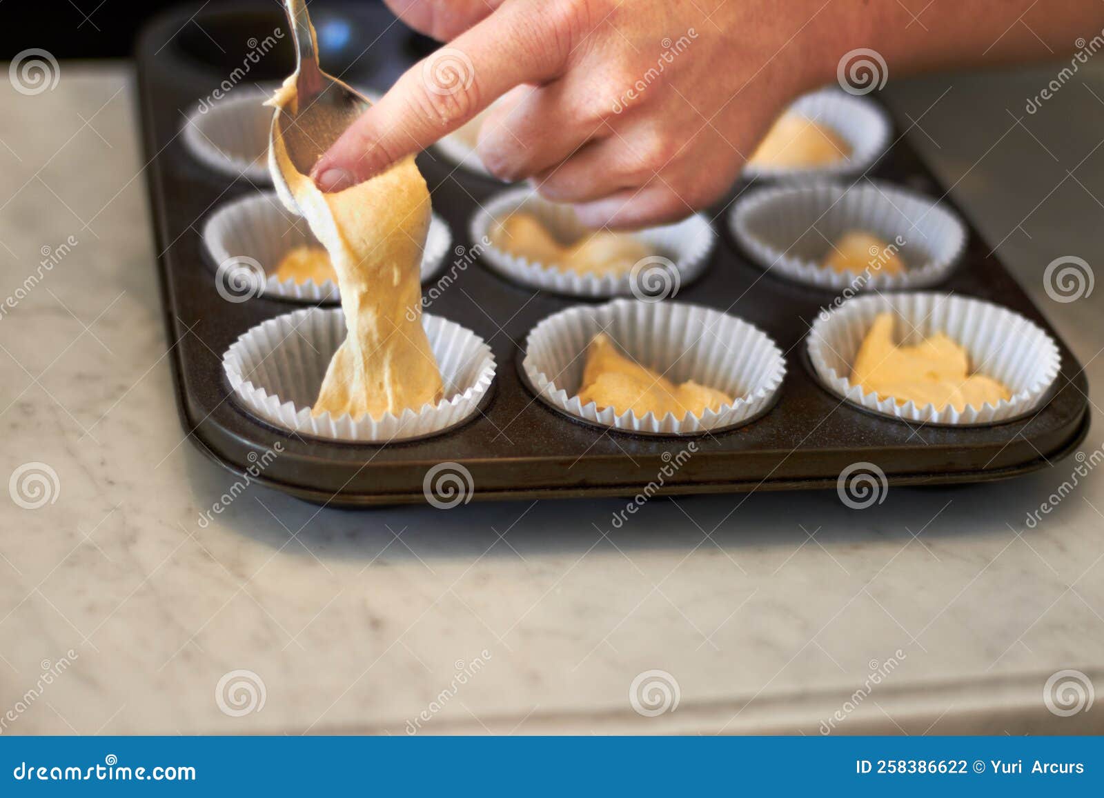 Making Sure All the Batter is Used. a Close Up of a Baker Pushing ...