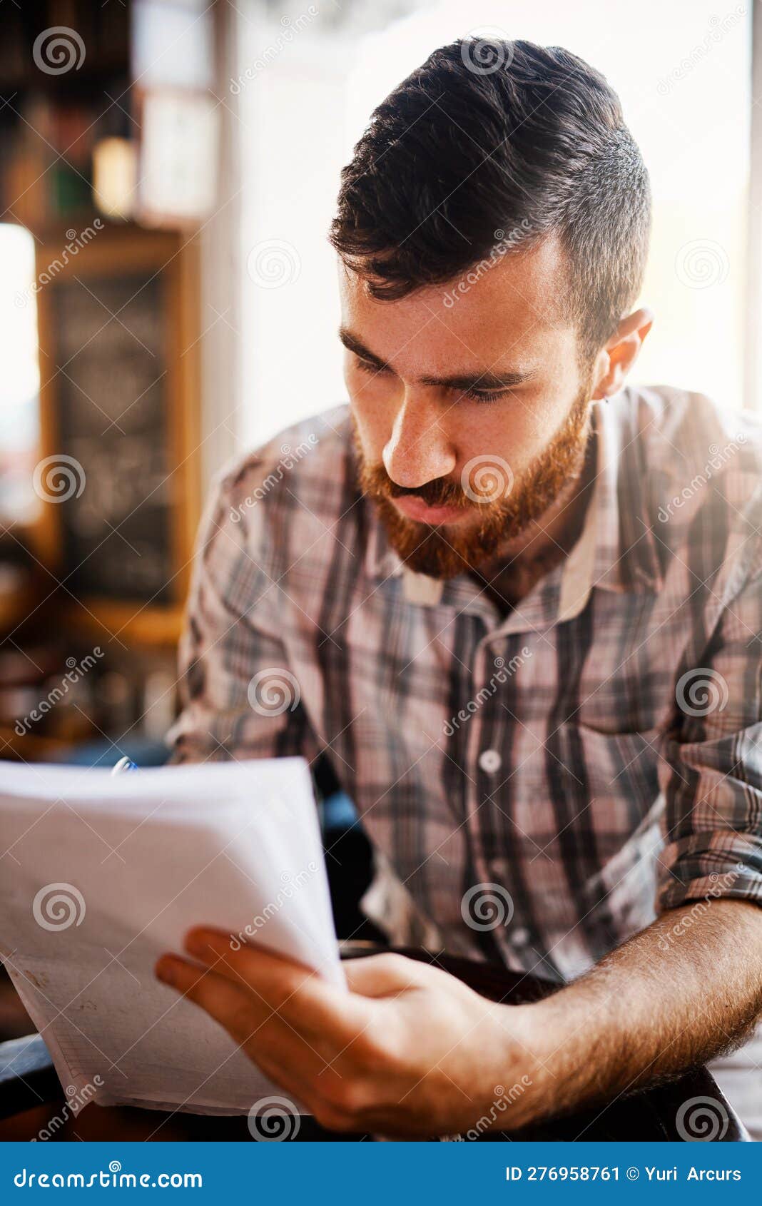 Making Sure Everything is Going Smoothly in the Books. a Shop Owner ...