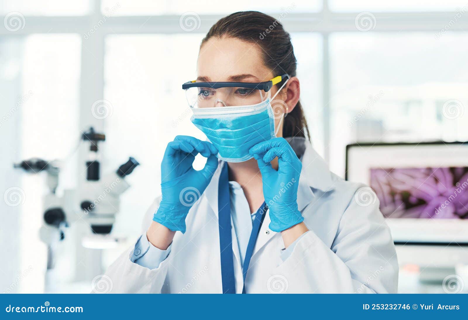 Making Sure Its on Properly. an Unrecognizable Young Female Scientist ...