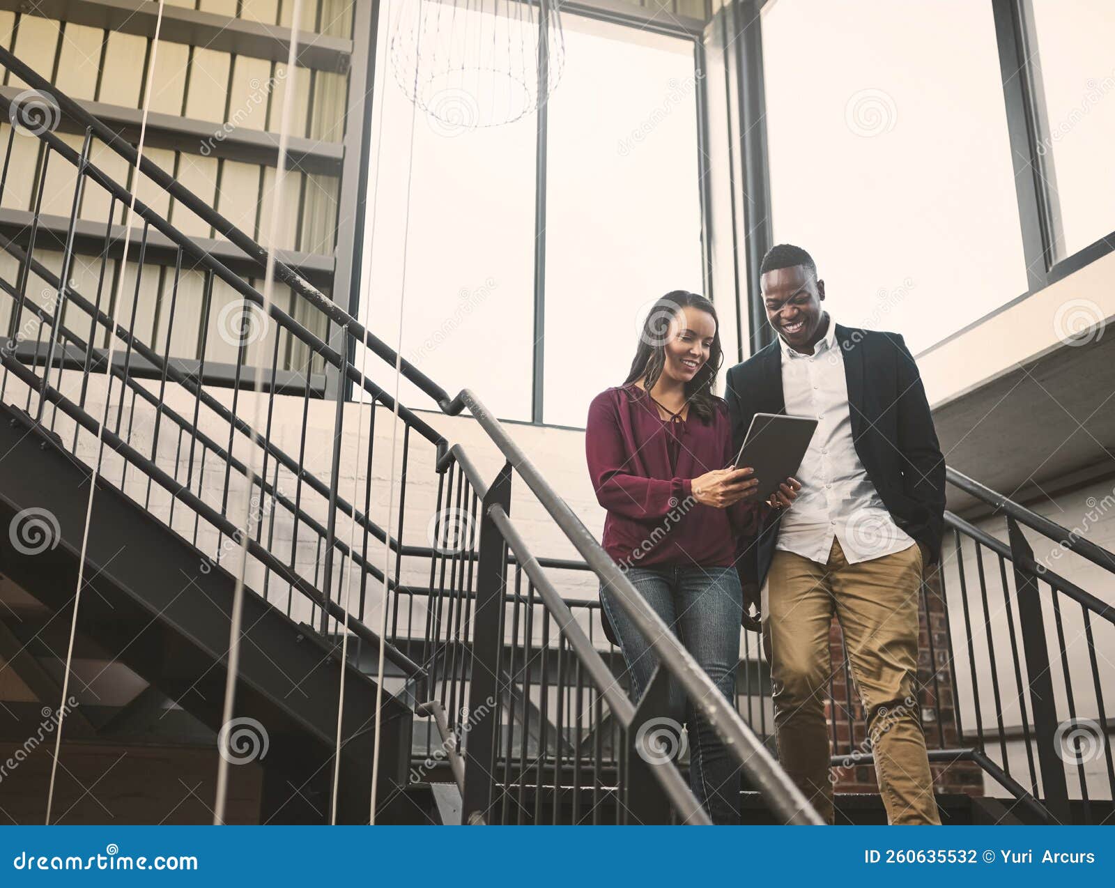 Making Their Meetings Mobile. Two Colleagues Having a Quick Meeting ...