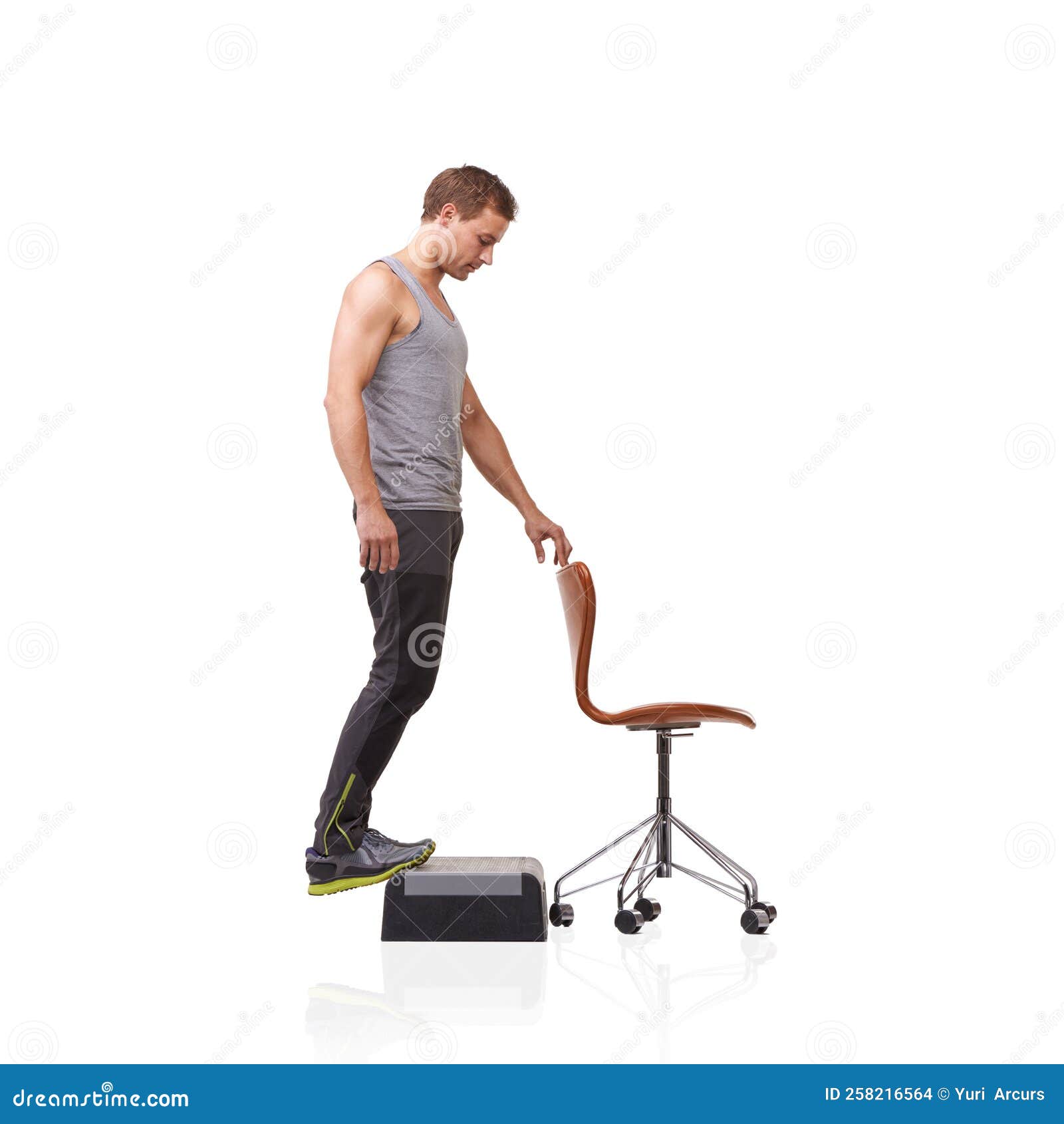 Making Use of His Surroundings during a Workout. Handsome Young Guy ...