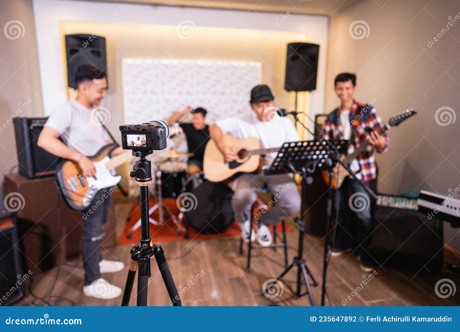 Making a Video Using a Camera when a Band Group of Young People ...