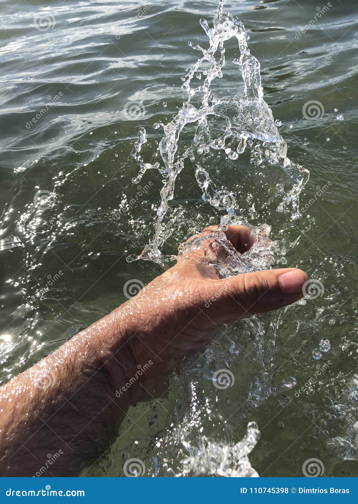 Catching water drops stock photo. Image of beach, making - 110745398