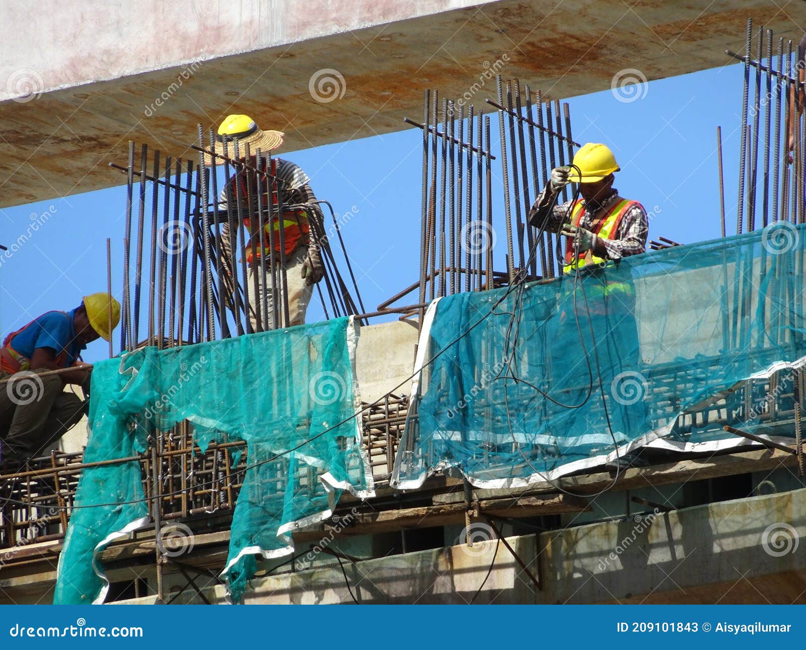 Construction Workers Working at Height at the Construction Site ...