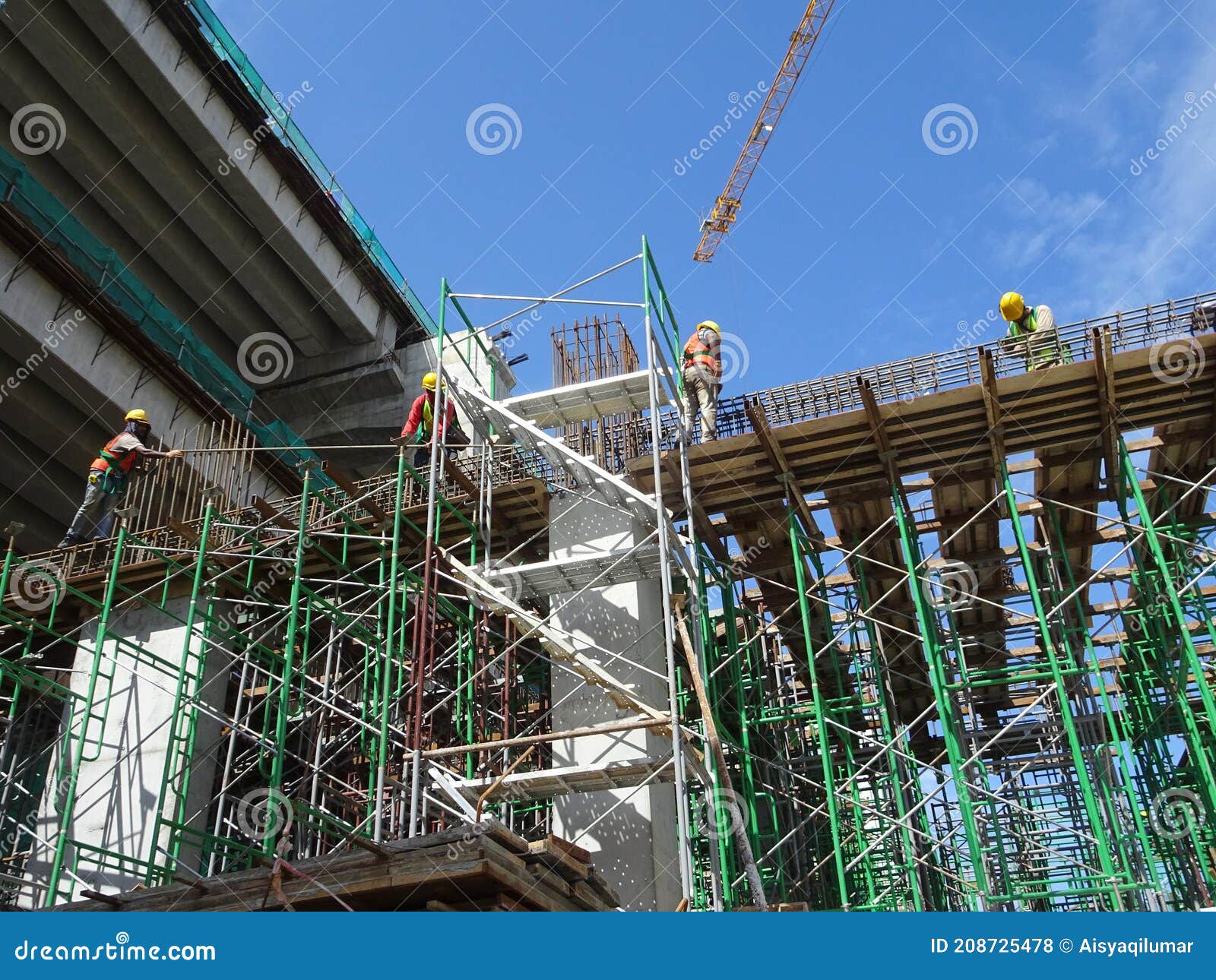 Construction Workers Working at Height Install Reinforcement Bars at ...