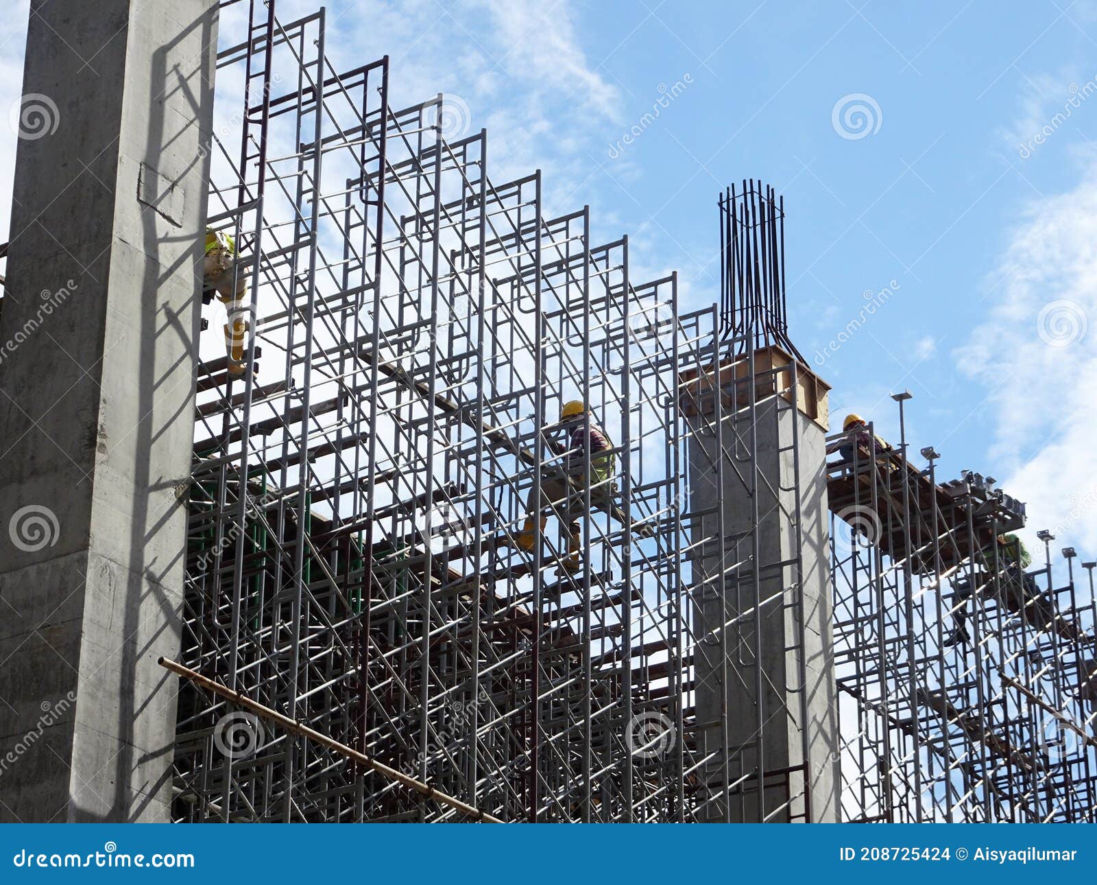 Construction Workers Working at Height Install Reinforcement Bars at ...