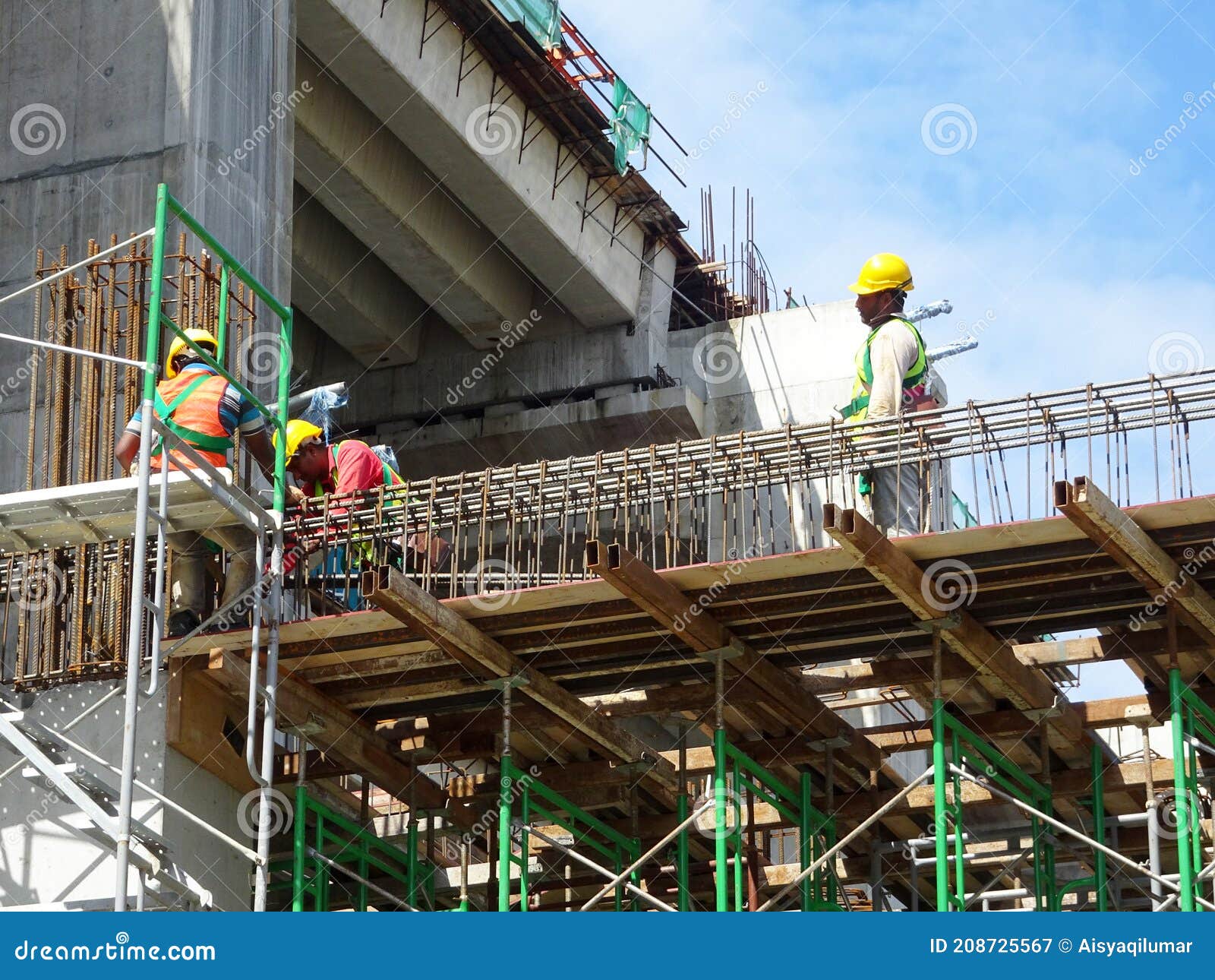 Construction Workers Working at Height Install Reinforcement Bars at ...