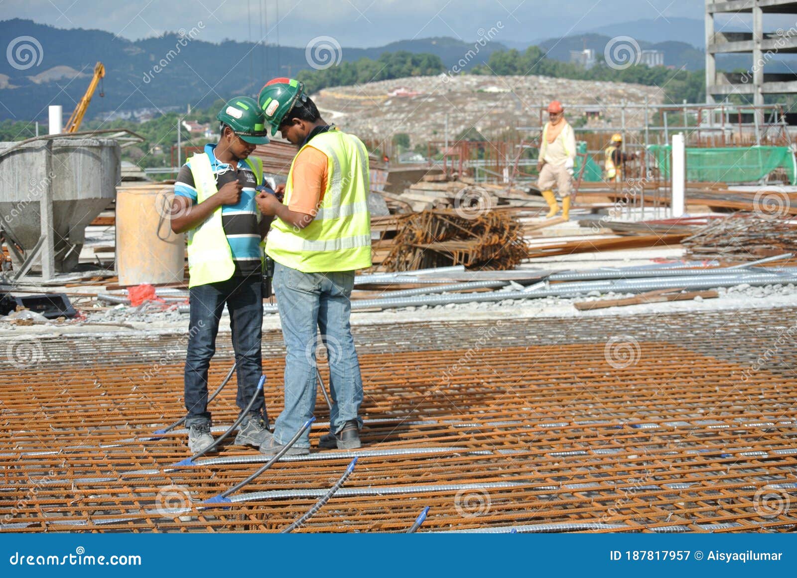 Construction Workers Having a Discussion at the Construction Site ...