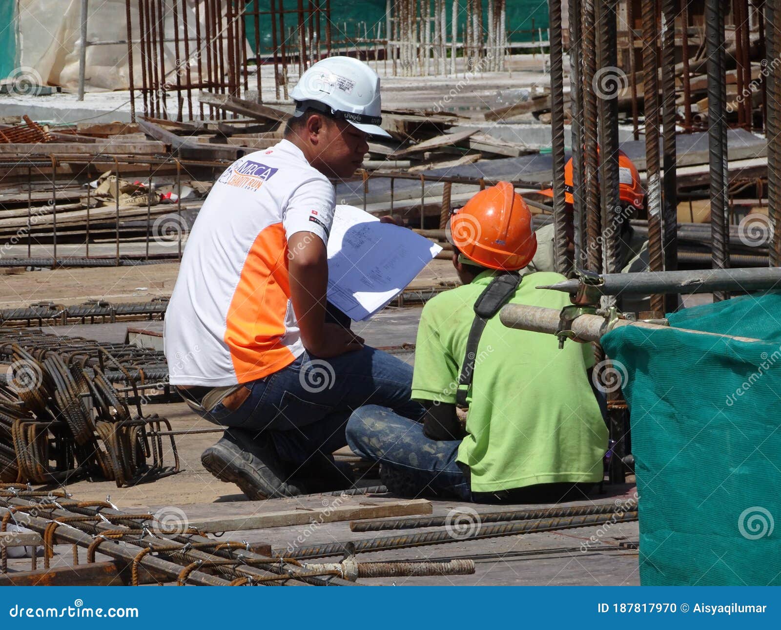 Construction Workers Having a Discussion at the Construction Site ...