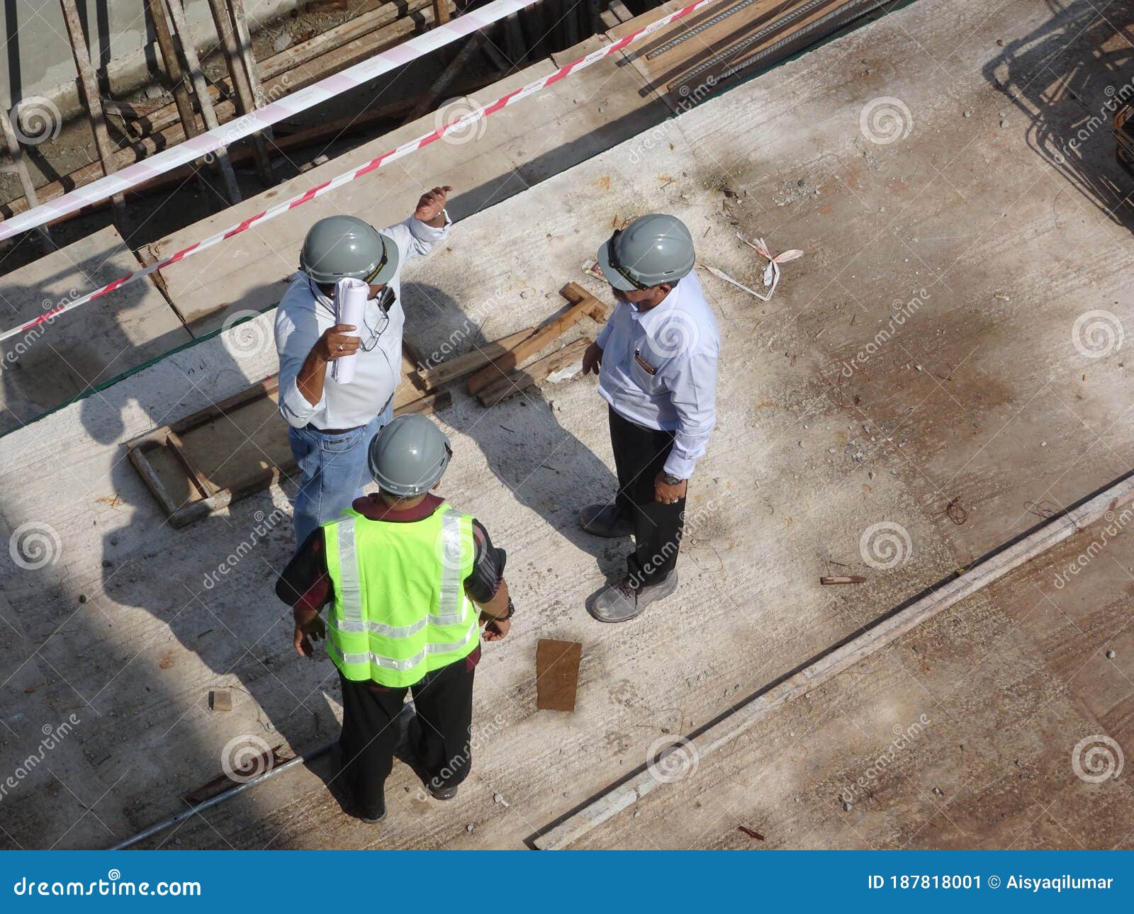 Construction Workers Having a Discussion at the Construction Site ...