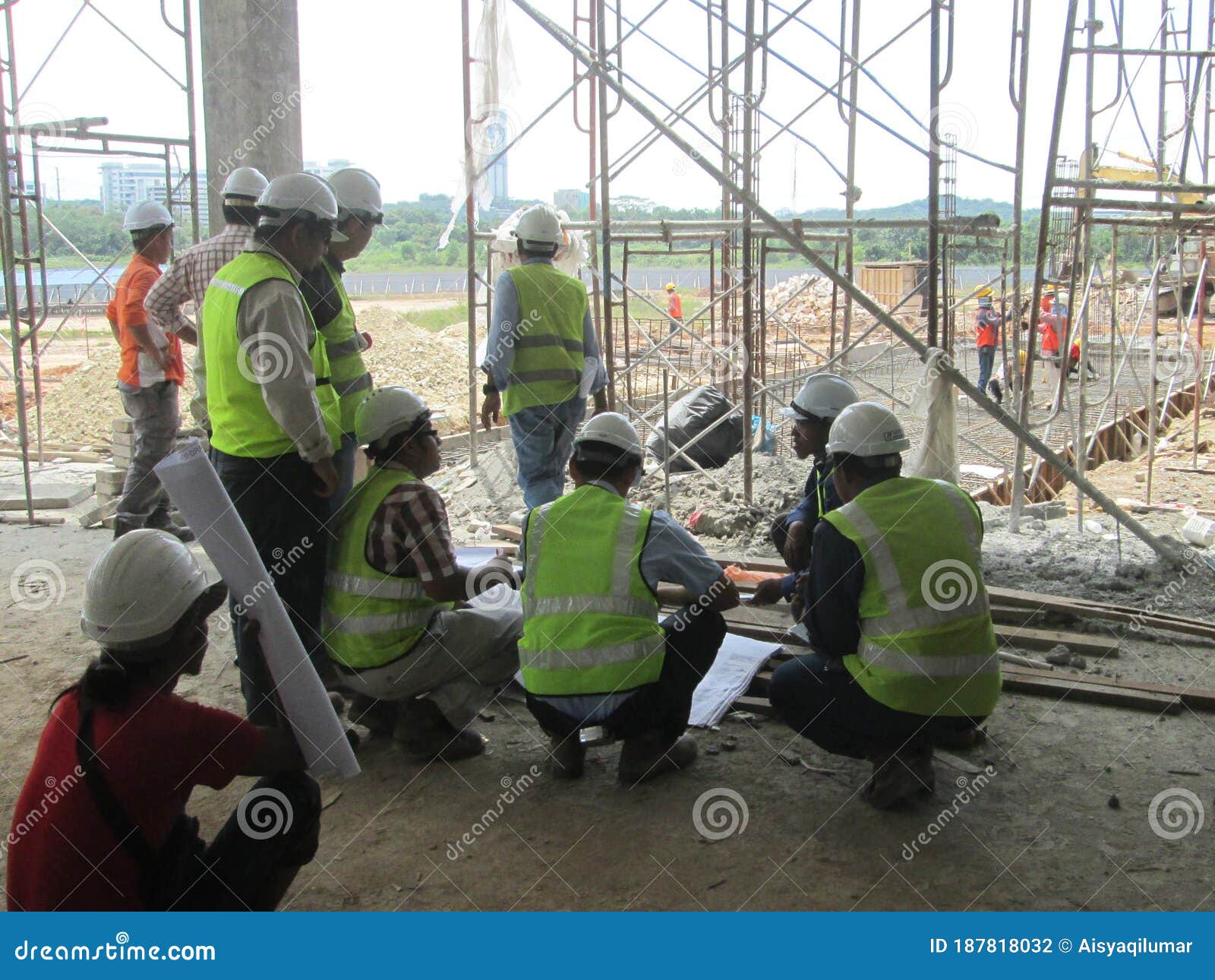 Construction Workers Having a Discussion at the Construction Site ...