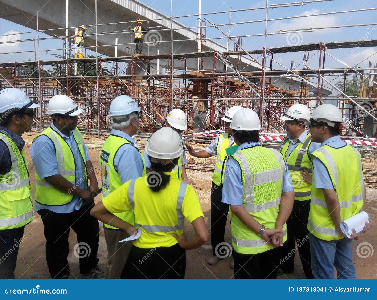 Construction Workers Having a Discussion at the Construction Site ...