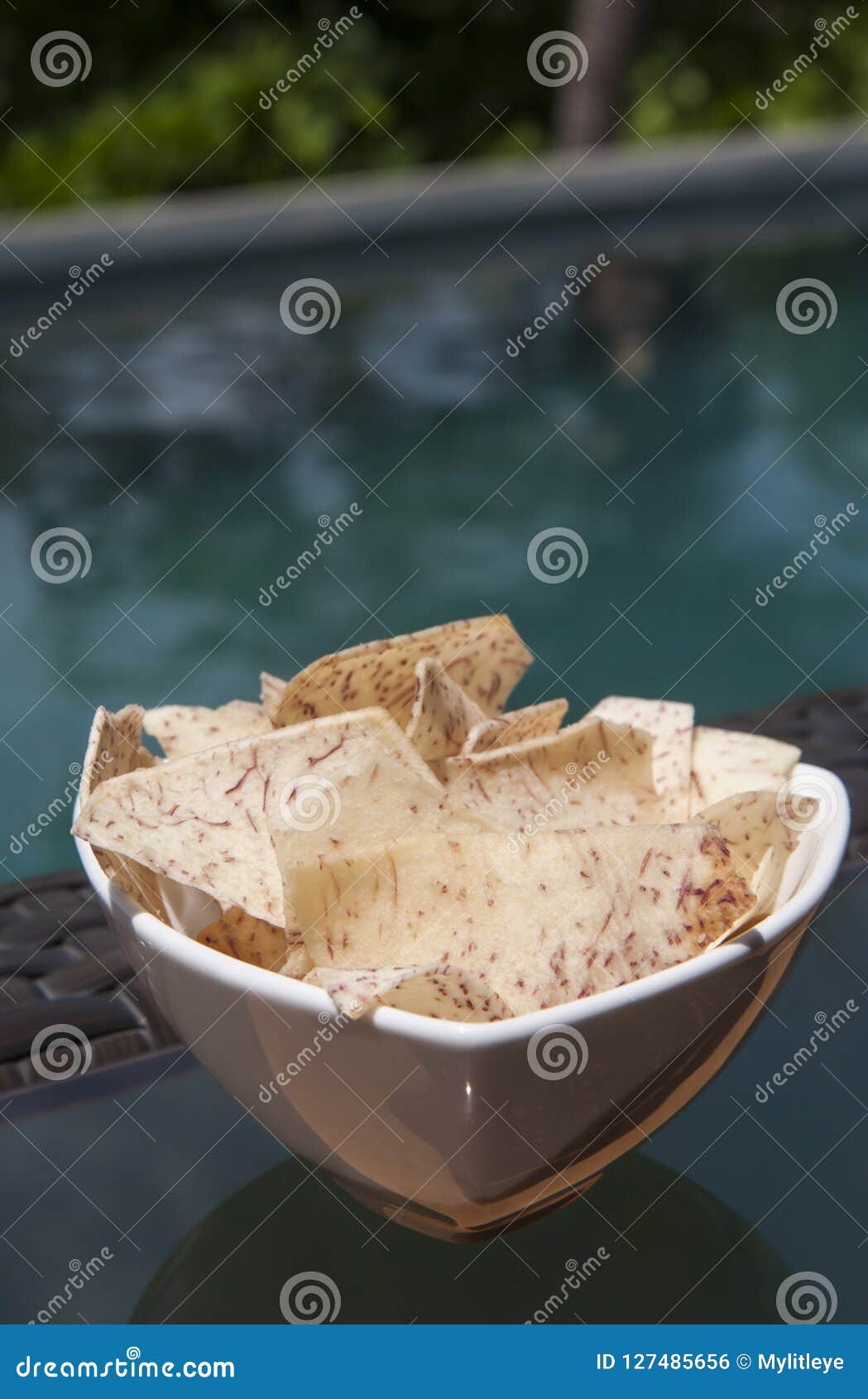 Malanga Chips by the Pool stock photo. Image of bowl - 127485656