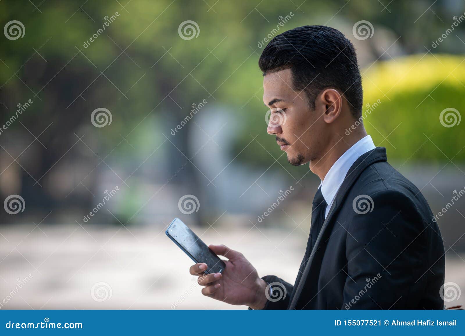 Malaysian Man with His Smartphone Stock Image - Image of outdoor ...