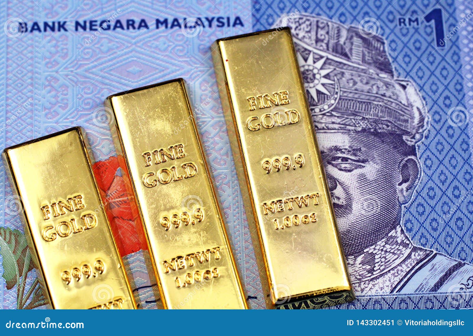 A Malaysian One Ringgit Bank Note with Three Gold Ingots Stock Image ...