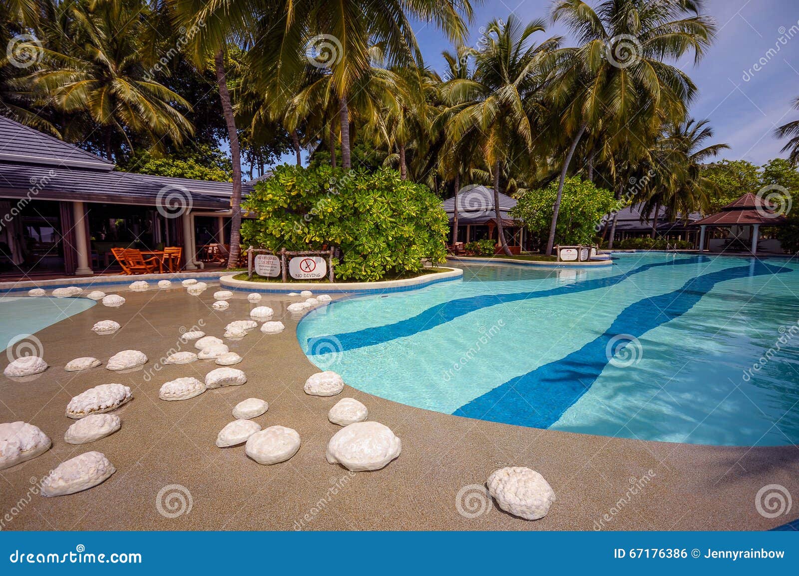 Maldivian resort pool side stock photo. Image of palm - 67176386