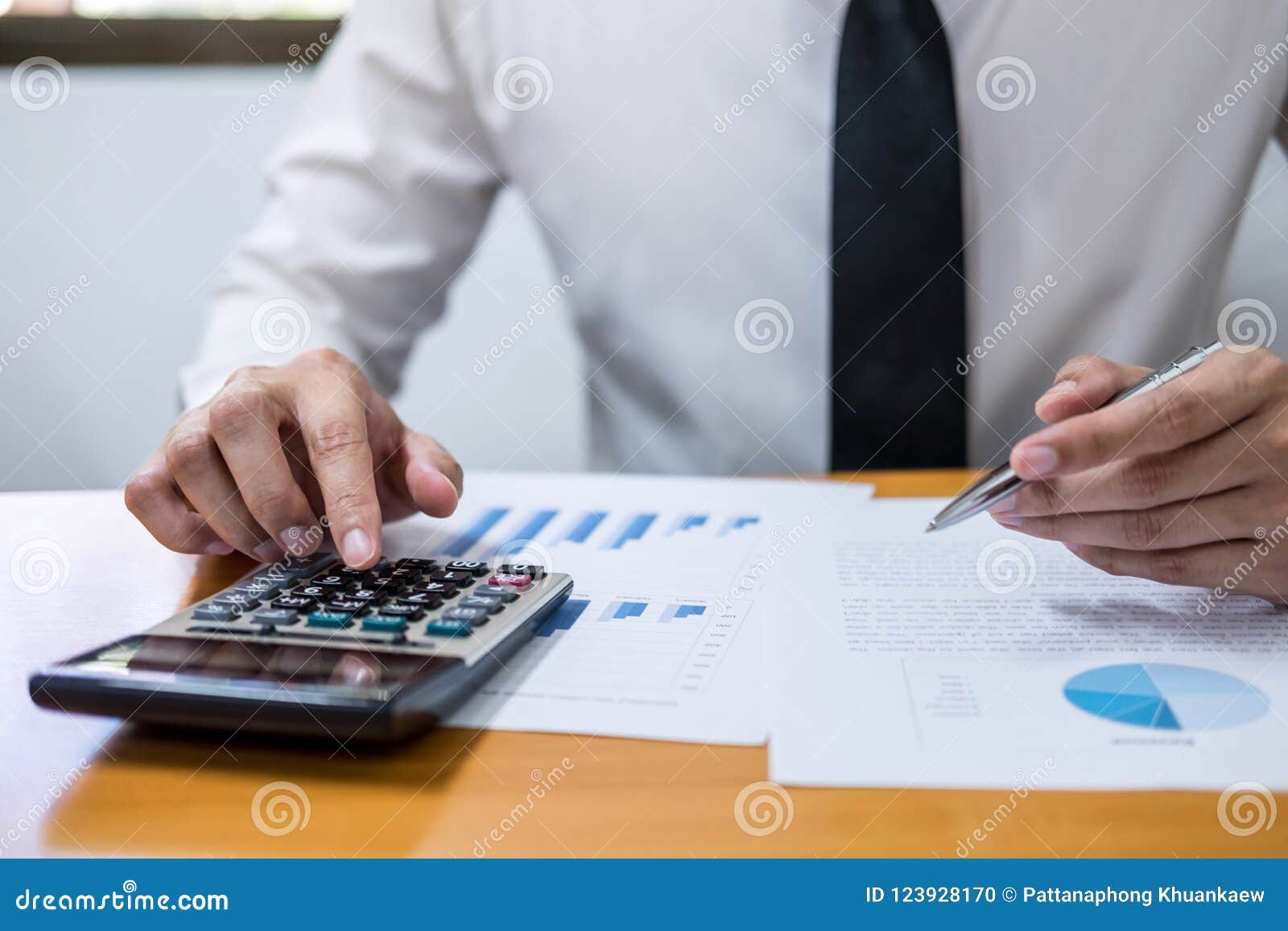 Male Accountant Calculations and Analyzing Financial Graph Data Stock ...