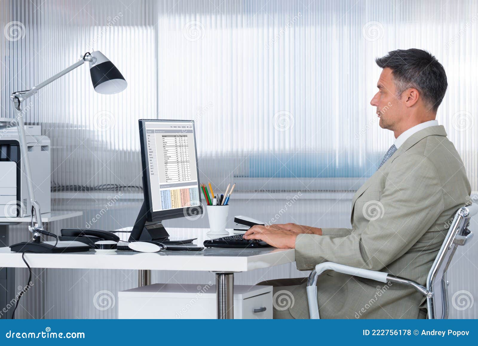 Male Accountant Using Computer at Desk Stock Photo - Image of ...