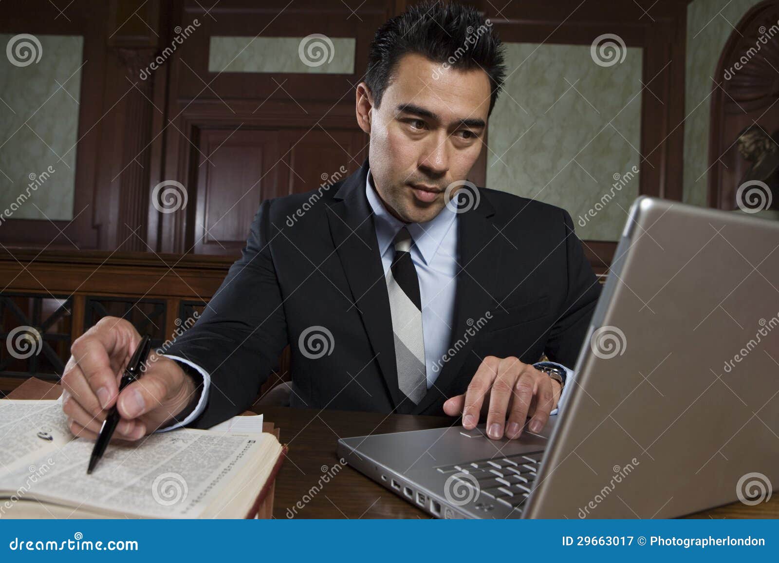 Male Advocate Using Laptop stock image. Image of indoors - 29663017
