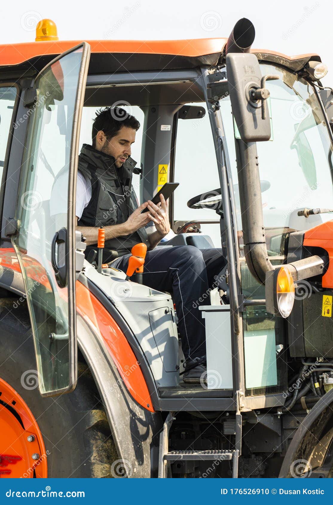 Male Agricultural Worker on Farm Uses Digital Tablet Stock Photo ...