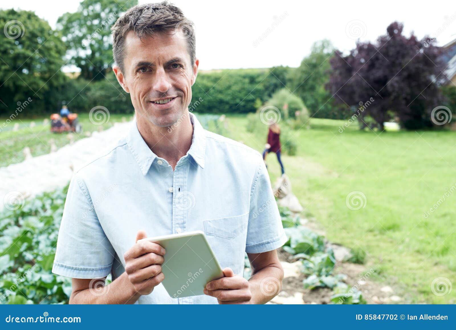 Male Agricultural Worker Using Digital Tablet in Field Stock Photo ...