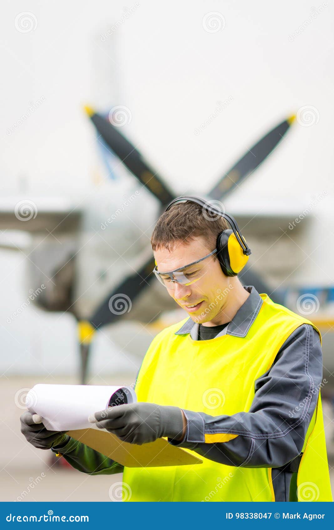 Happy Maintenance Engineers Looking Away In Automobile Repair Shop ...