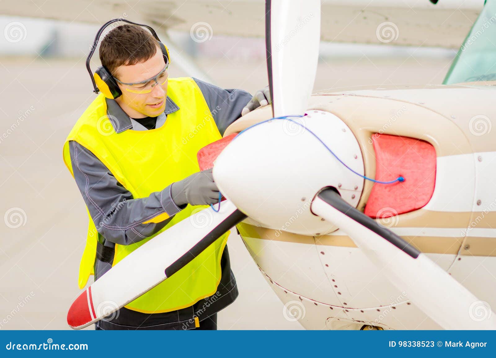 Happy Maintenance Engineers Looking Away In Automobile Repair Shop ...