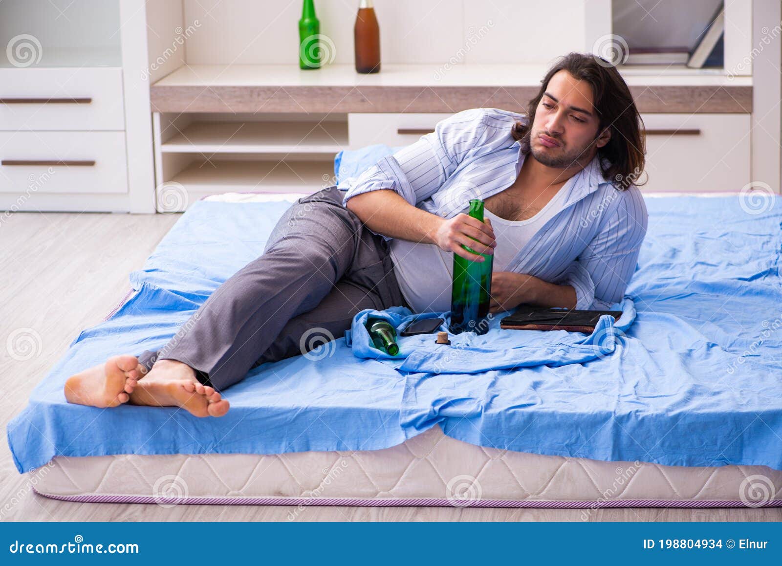 Young Male Alcoholic in the Bedroom Stock Photo - Image of headache ...