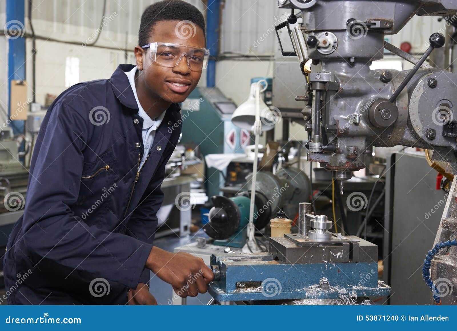 Male Apprentice Engineer Working on Drill in Factory Stock Photo ...
