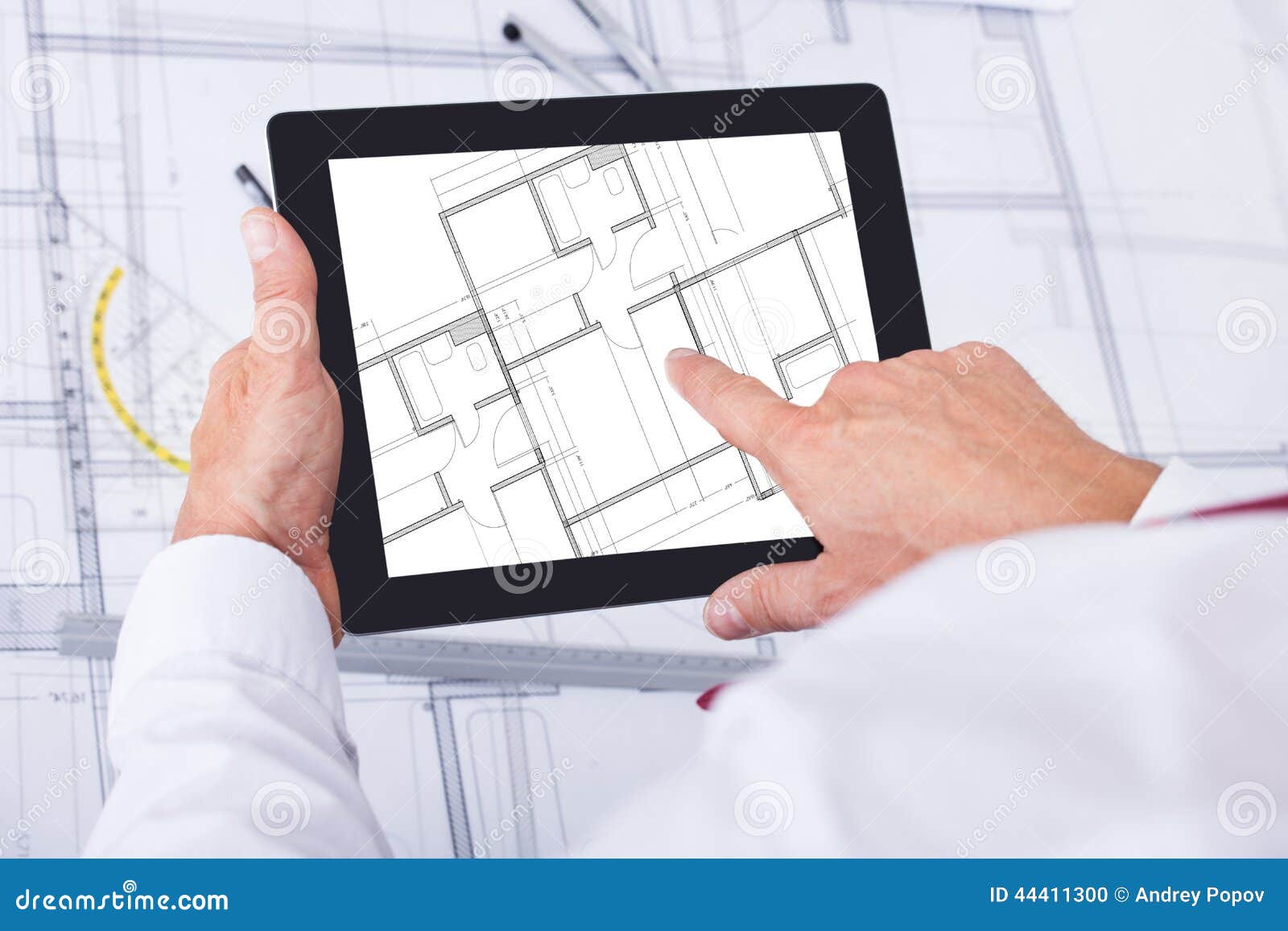 Male Architect Analyzing Blueprint Over Digital Tablet Stock Photo ...