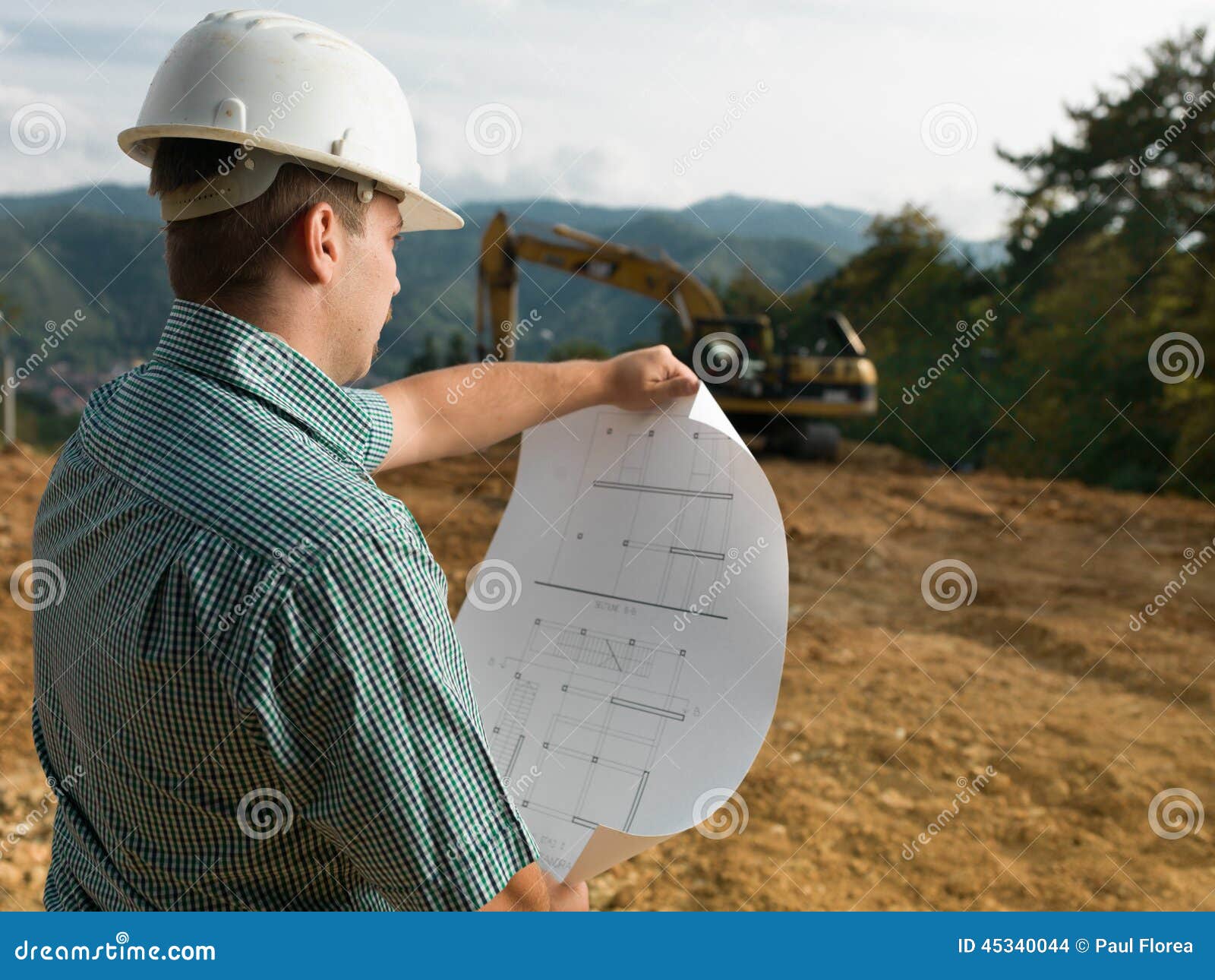 Male Architect Reading Construction Plan Stock Photo - Image of ...