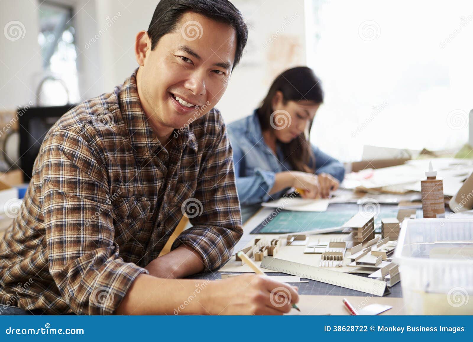 Male Architect Working on Model in Office Stock Photo - Image of ...