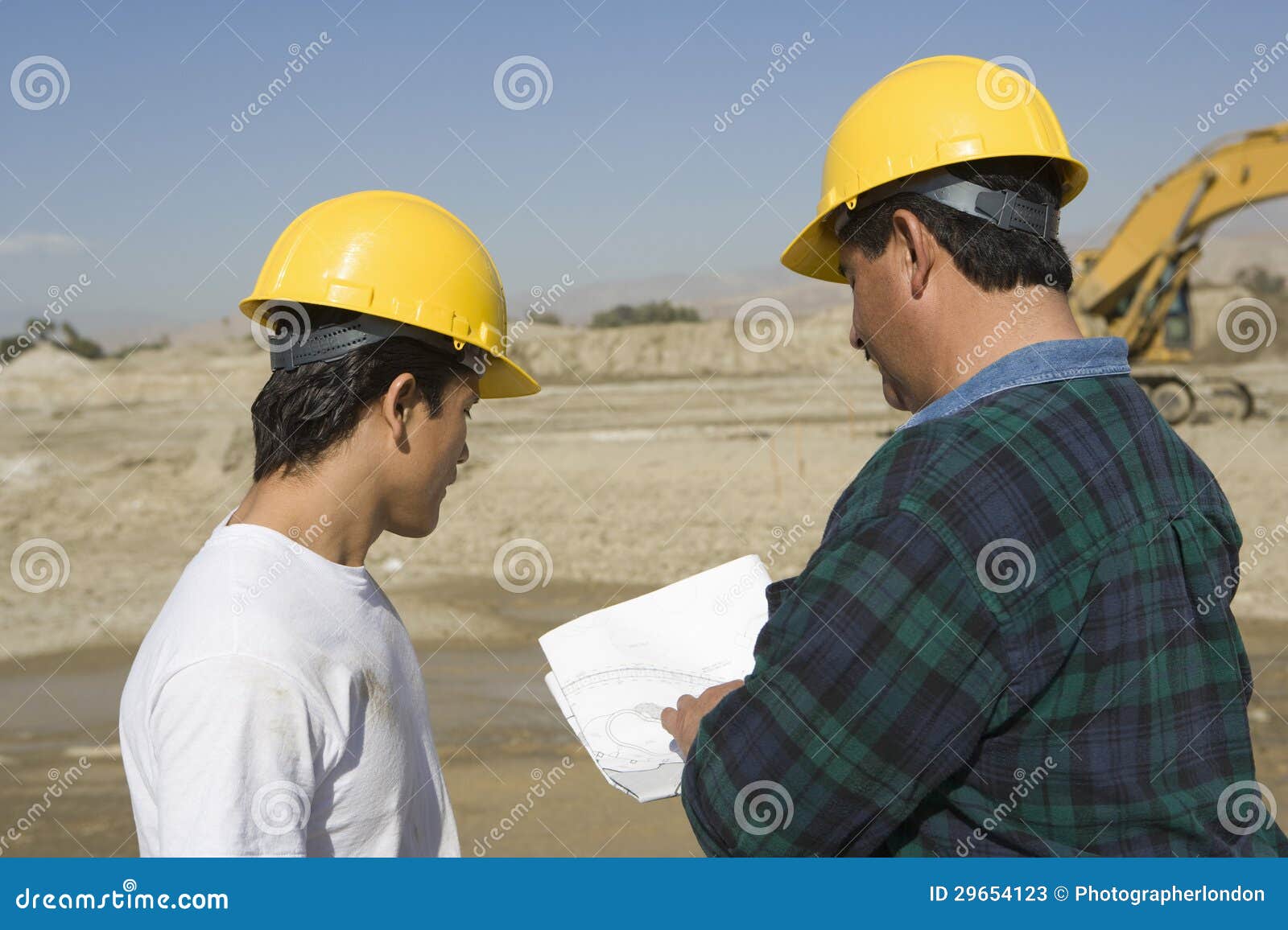Male Architects Discussing at Construction Site Stock Image - Image of ...