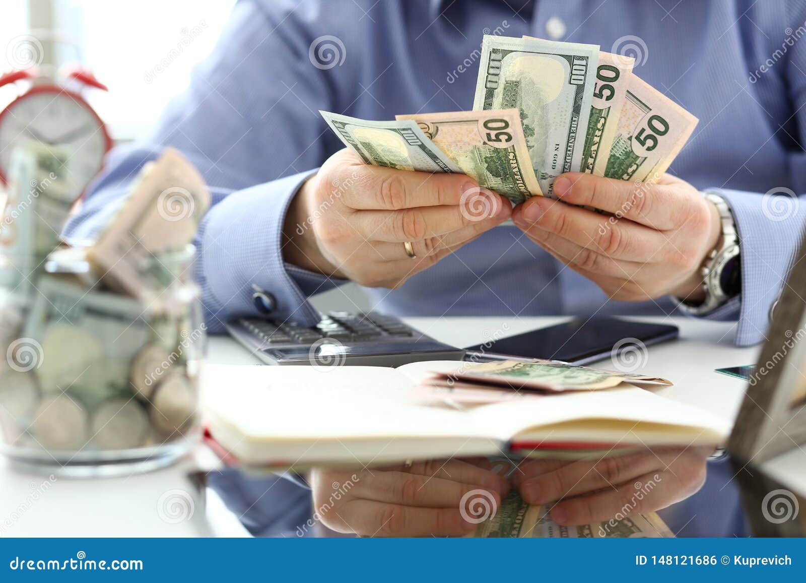 Male Arms Counting Big Amount of US Currency at Worktable Stock Photo ...