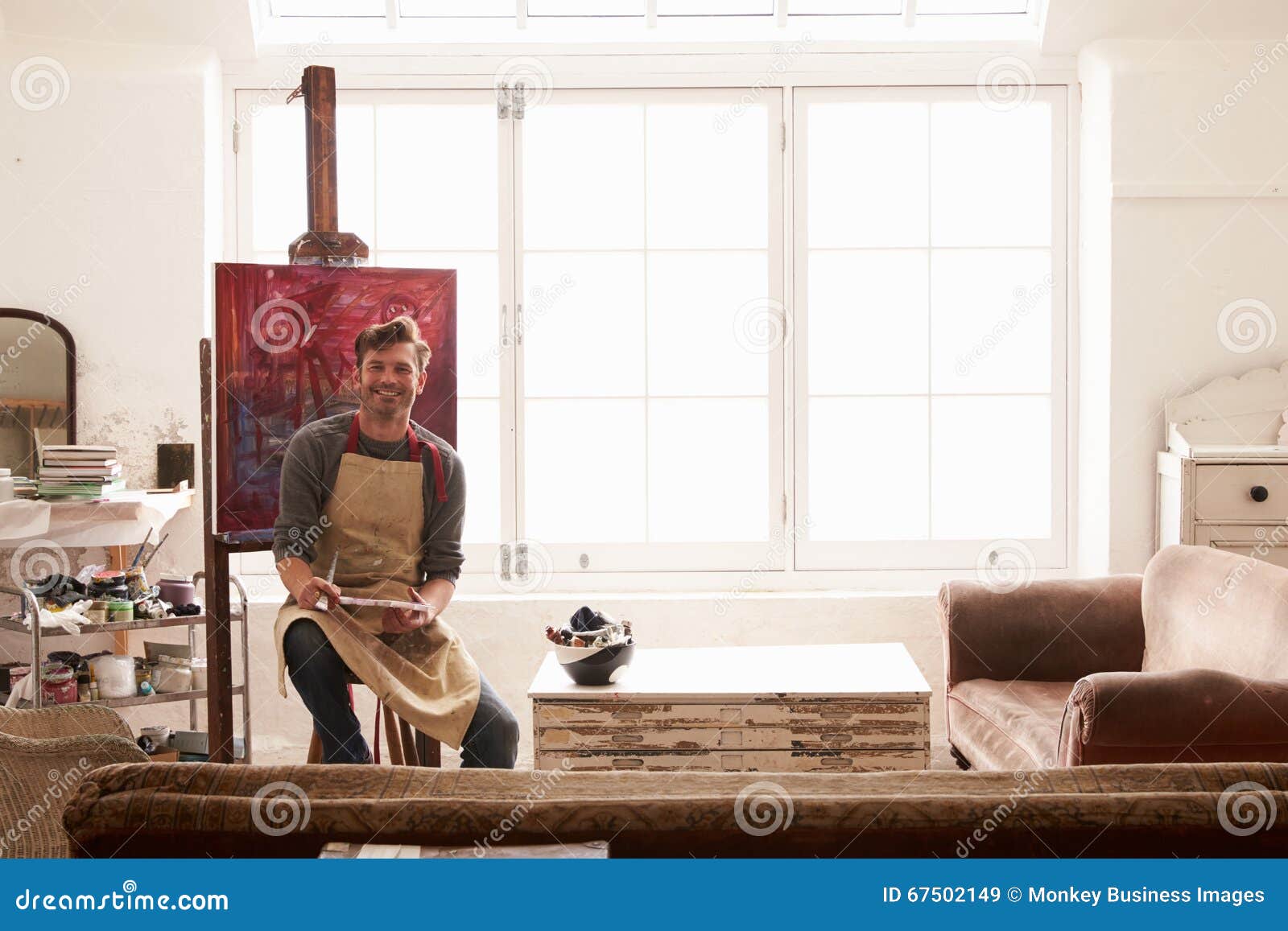 Male Artist Working on Painting in Bright Daylight Studio Stock Image ...