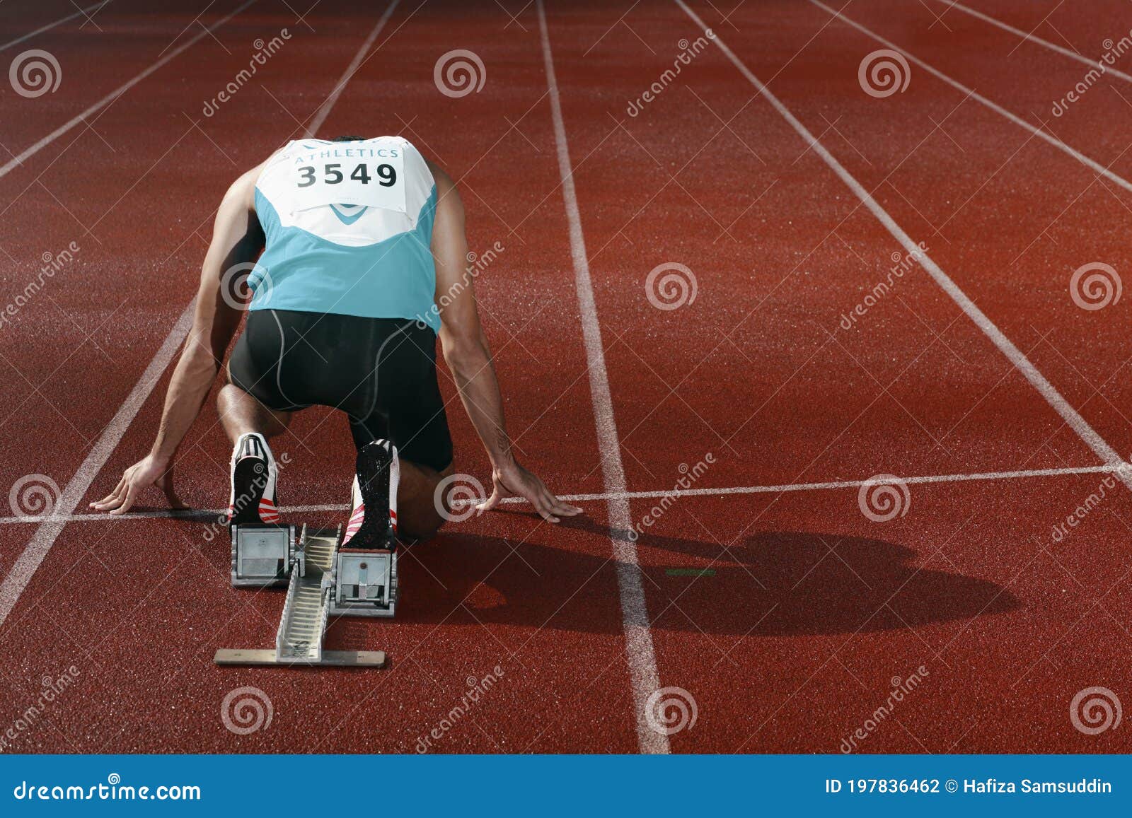 Male Athlete Crouching on Starting Line Stock Photo - Image of focus ...
