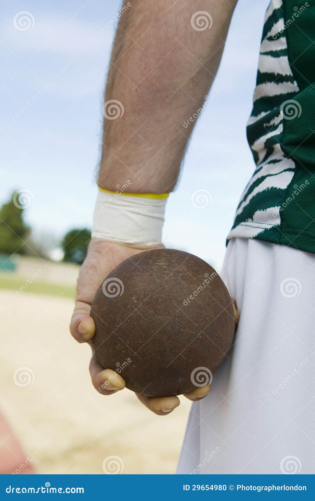 Male Athlete Holding Shot Put Stock Photo - Image of fitness, healthy ...