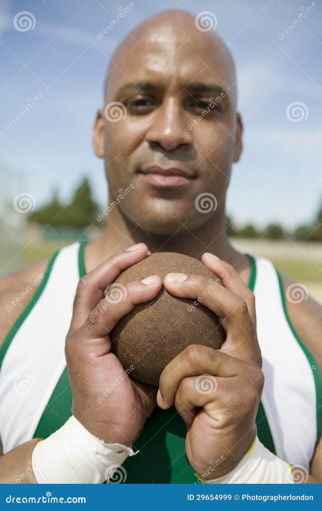 Male Athlete Holding Shot Put Stock Image - Image of african, gripping ...