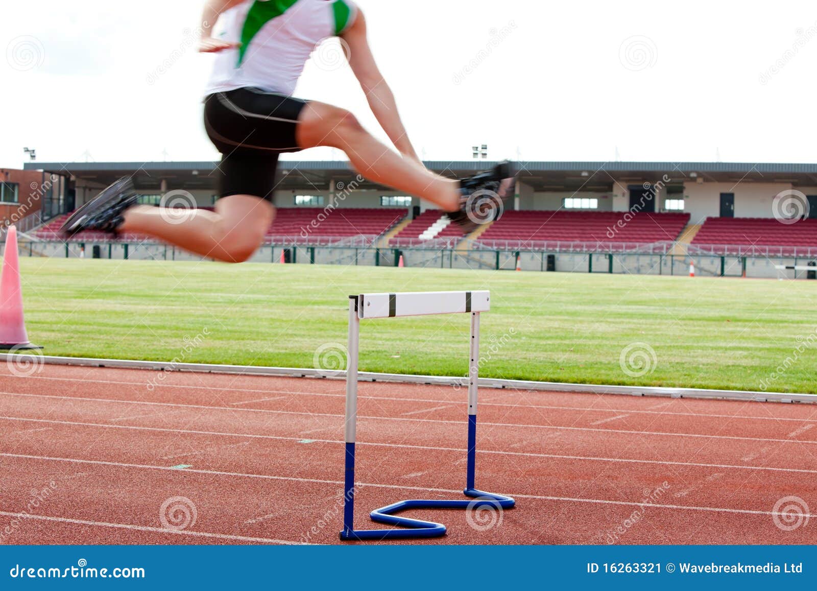 Male Athlete Jumping Above a Hedge during a Race Stock Image - Image of ...