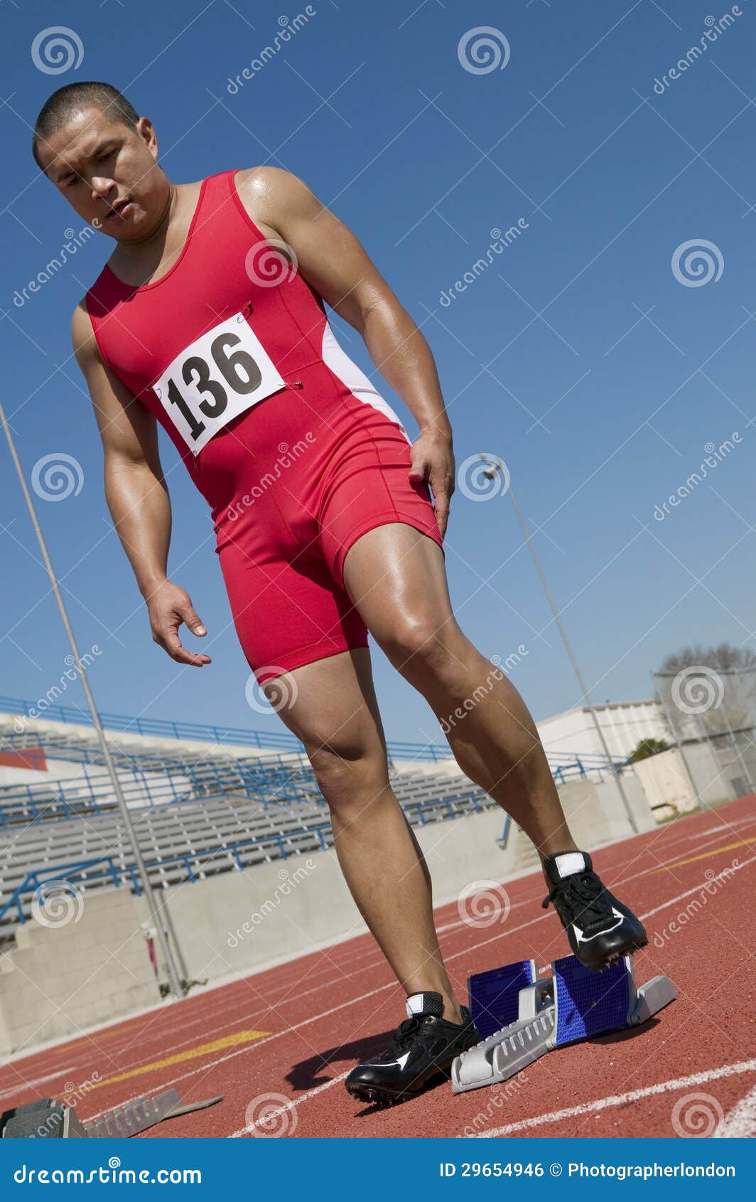Male Athlete at Starting Line on Racetrack Stock Photo - Image of ...