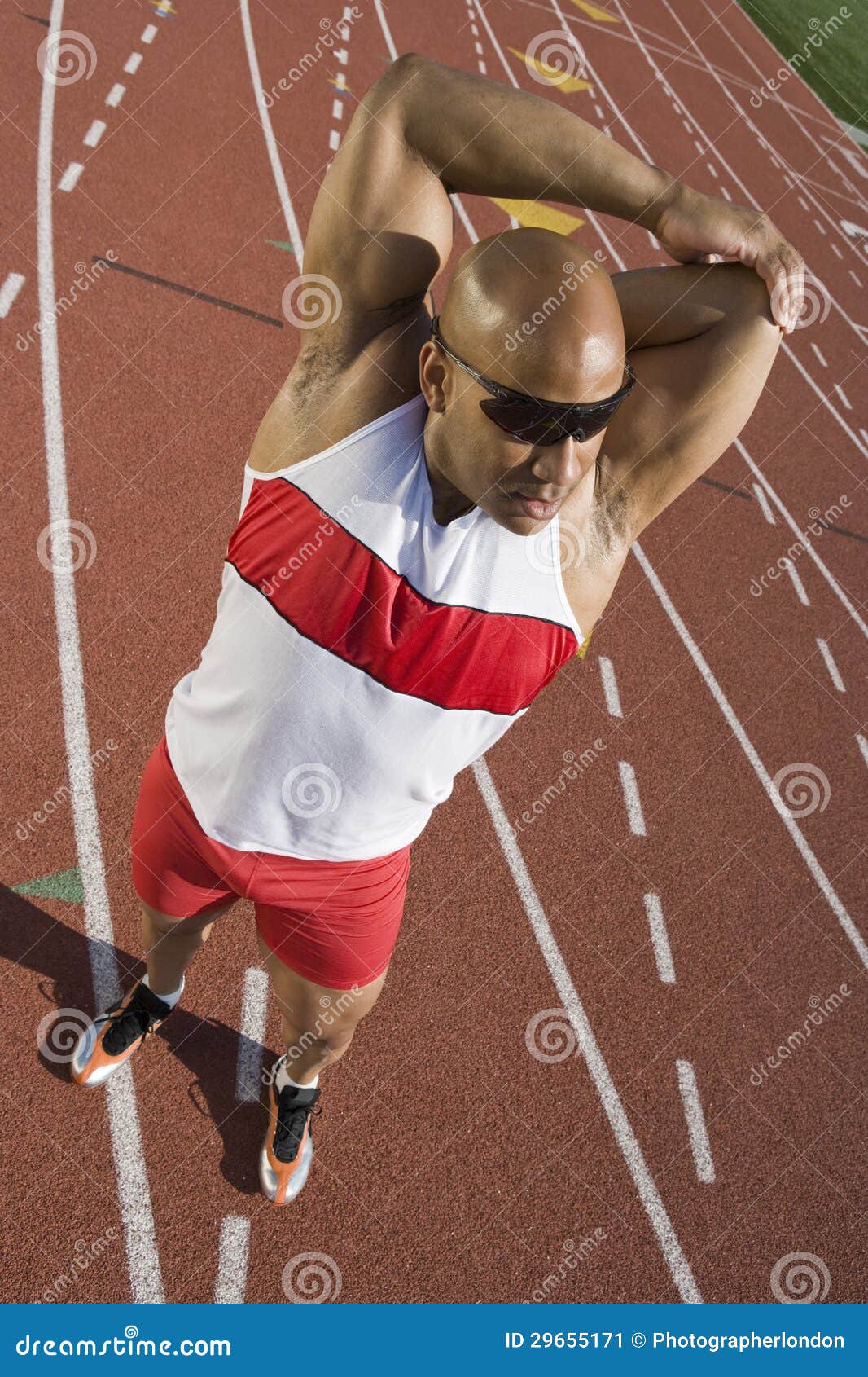 Male Athlete Stretching on Race Track Stock Image - Image of people ...