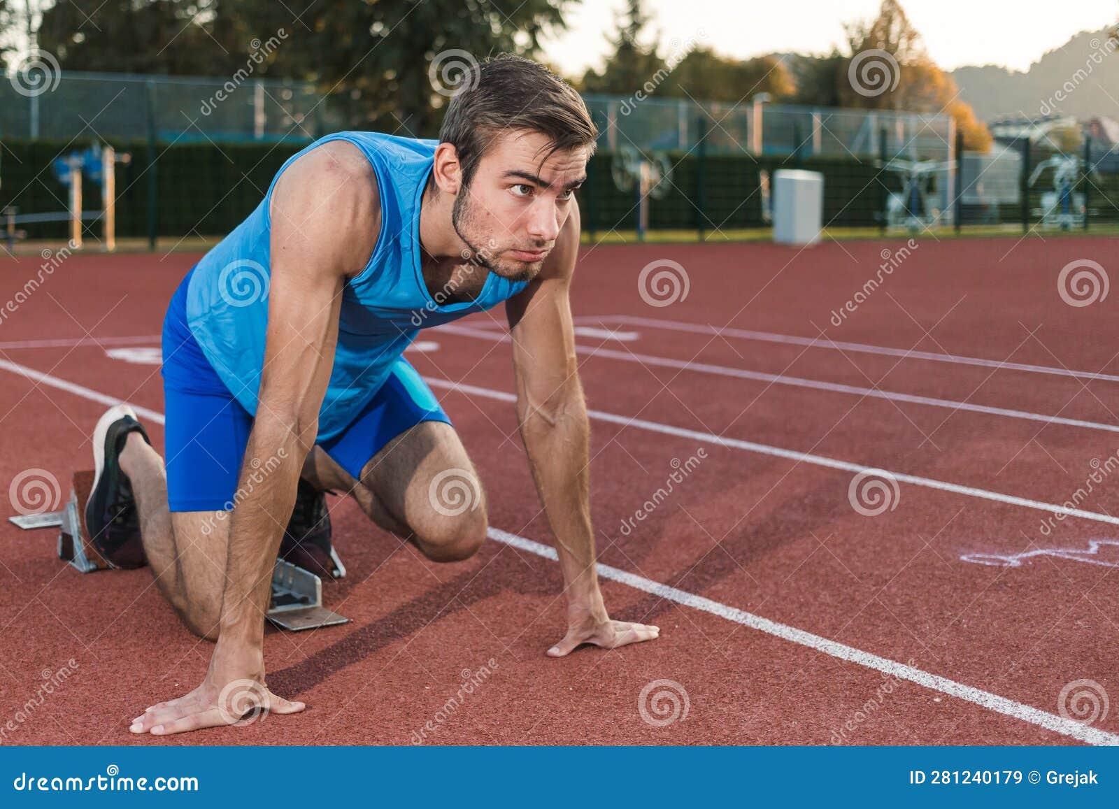 Male Athlete Taking a Start Position for a Sprint Run Stock Image ...