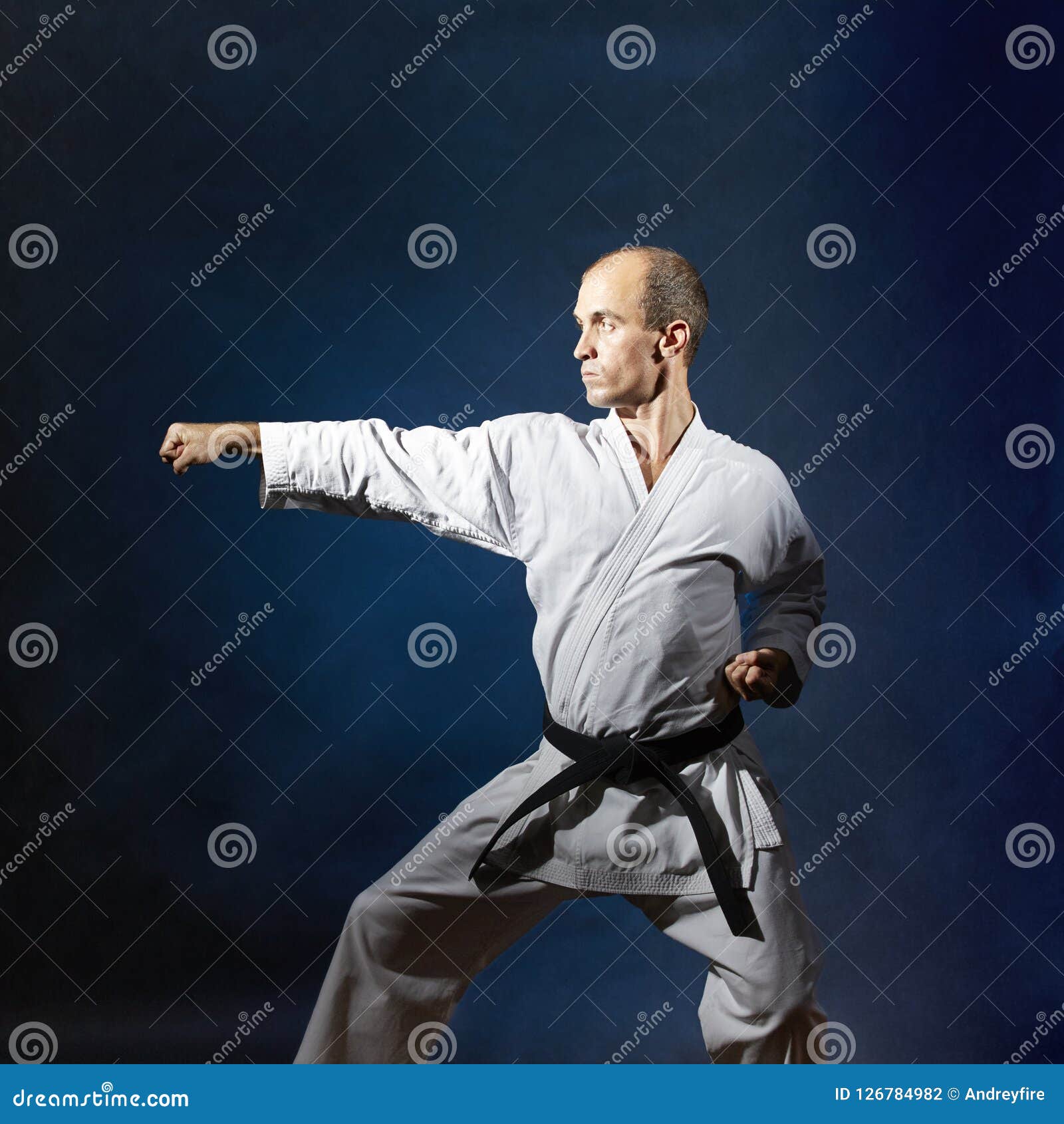 Male Athlete Trains Formal Karate Exercise Stock Photo - Image of black ...
